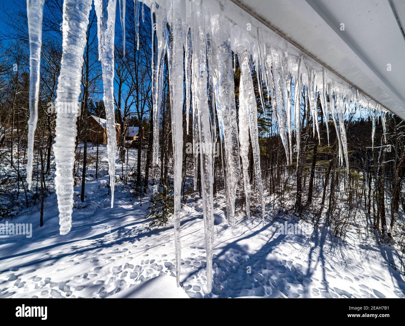 Connecticut, USA, 8 February 2021 - Icecles hanging from the roof of a ...