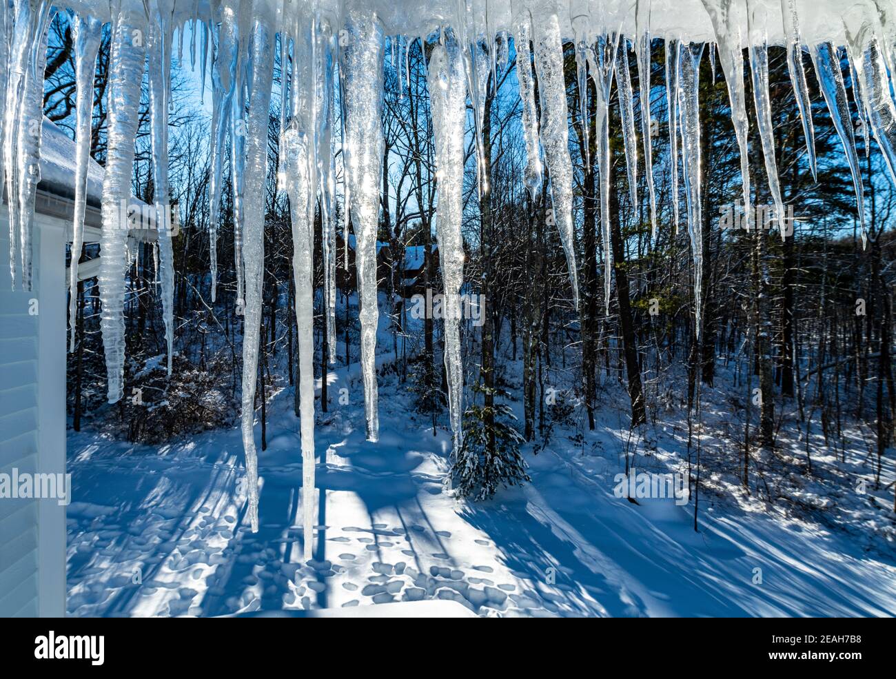 Connecticut, USA, 8 February 2021 - Icecles hanging from the roof of a ...