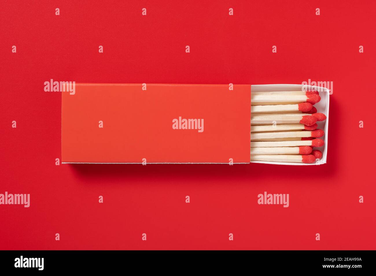 red matchbox and red match sticks on a red background Stock Photo - Alamy