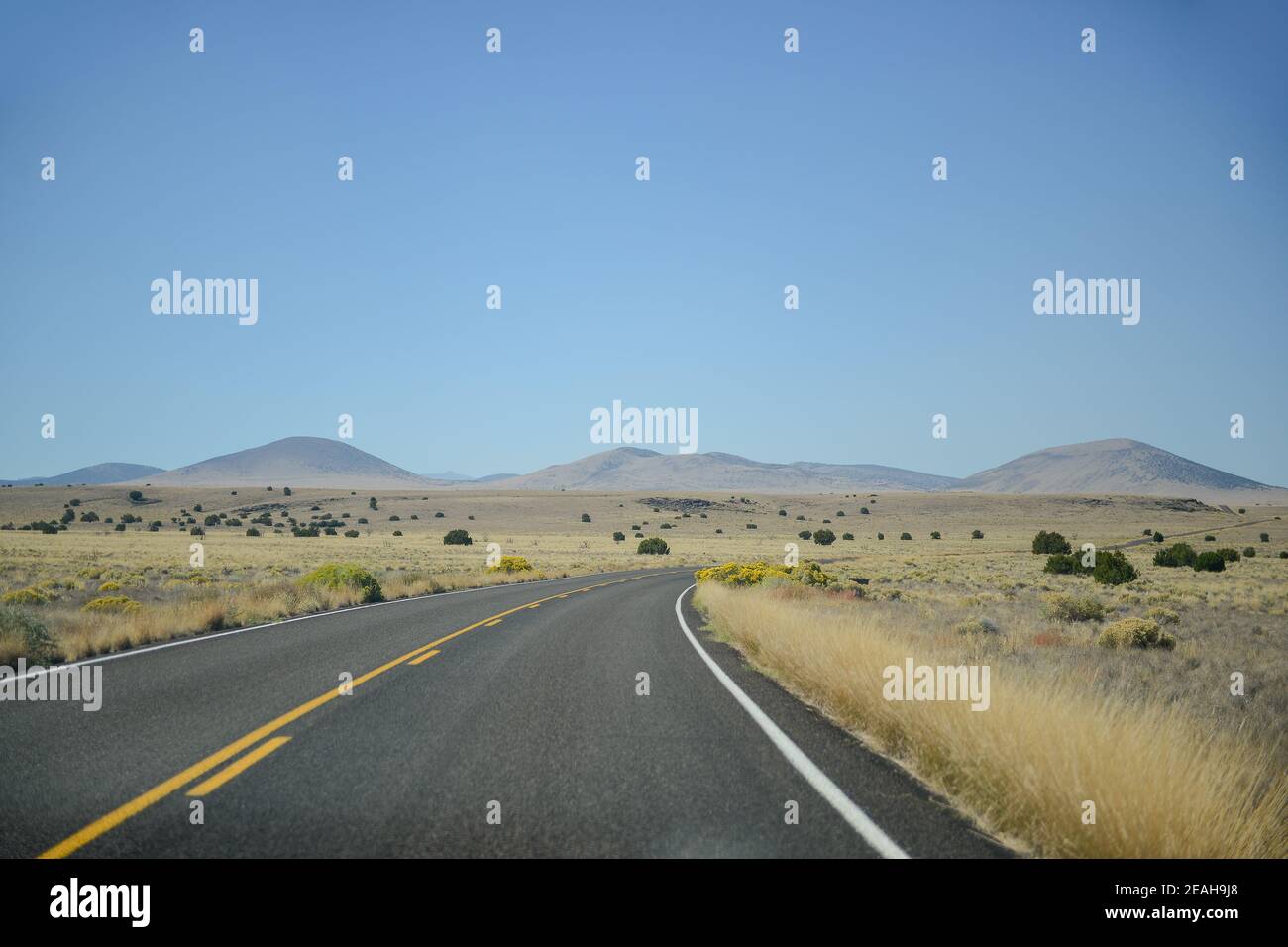 Driving the desert road to the painted hi-res stock photography and ...