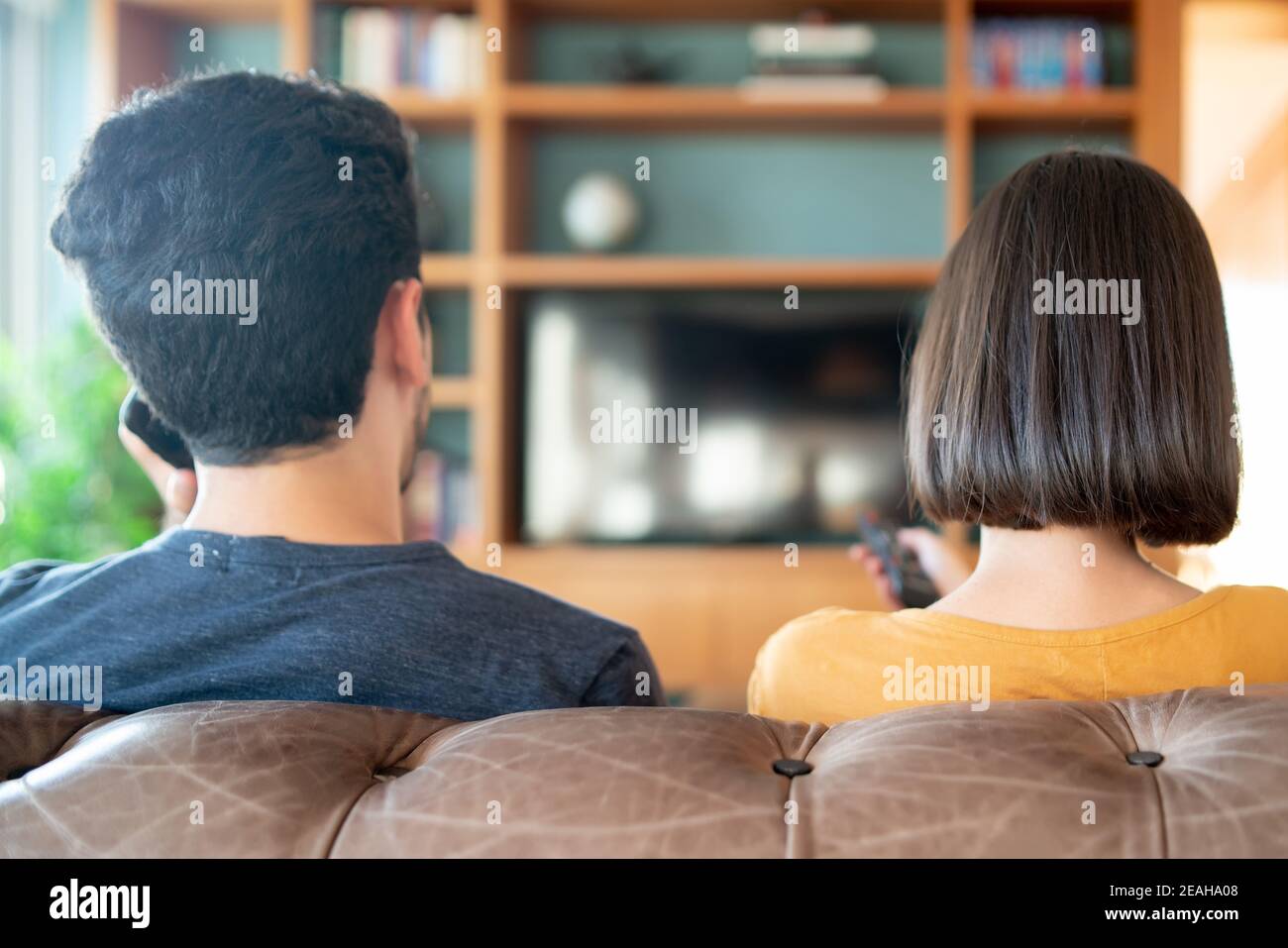 Staying home watching tv hi-res stock photography and images - Alamy