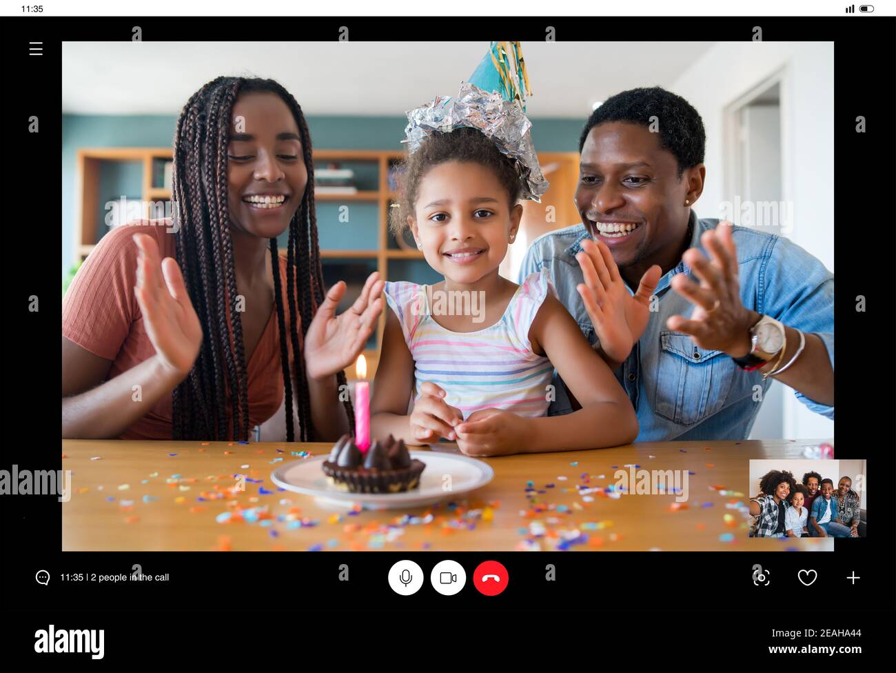 Family celebrating birthday on a video call Stock Photo - Alamy