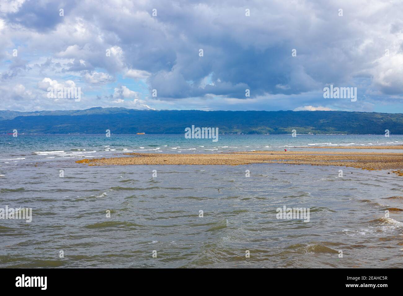 Seaside landscape with sand bar and distant island. Tropical seashore ...