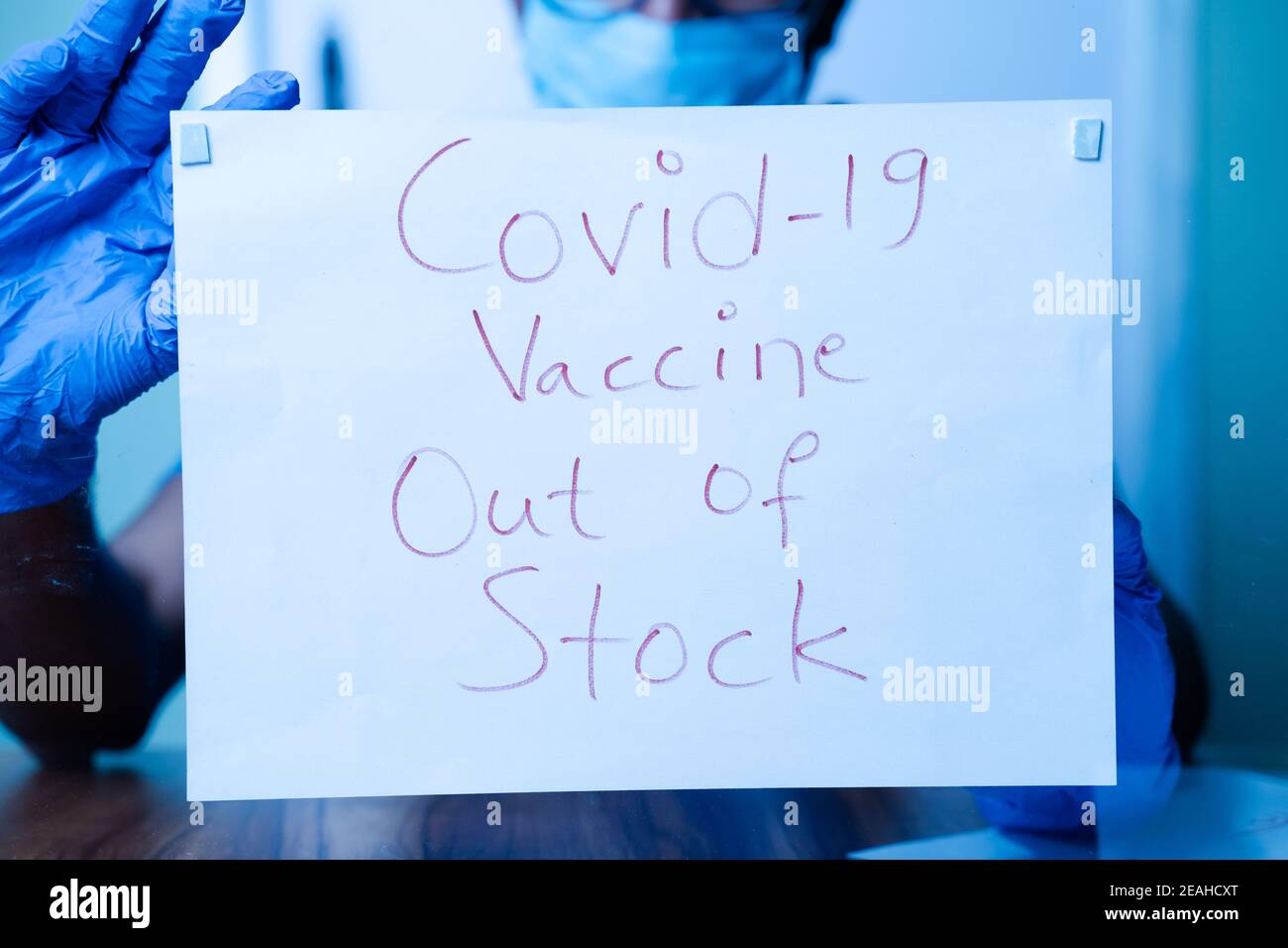Selective focus on Notice, Doctor or nurse pasting Covid-19 vaccine not ...