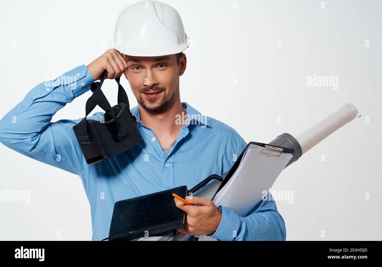 Architect builder in a white helmet with a tube and documents 3D ...