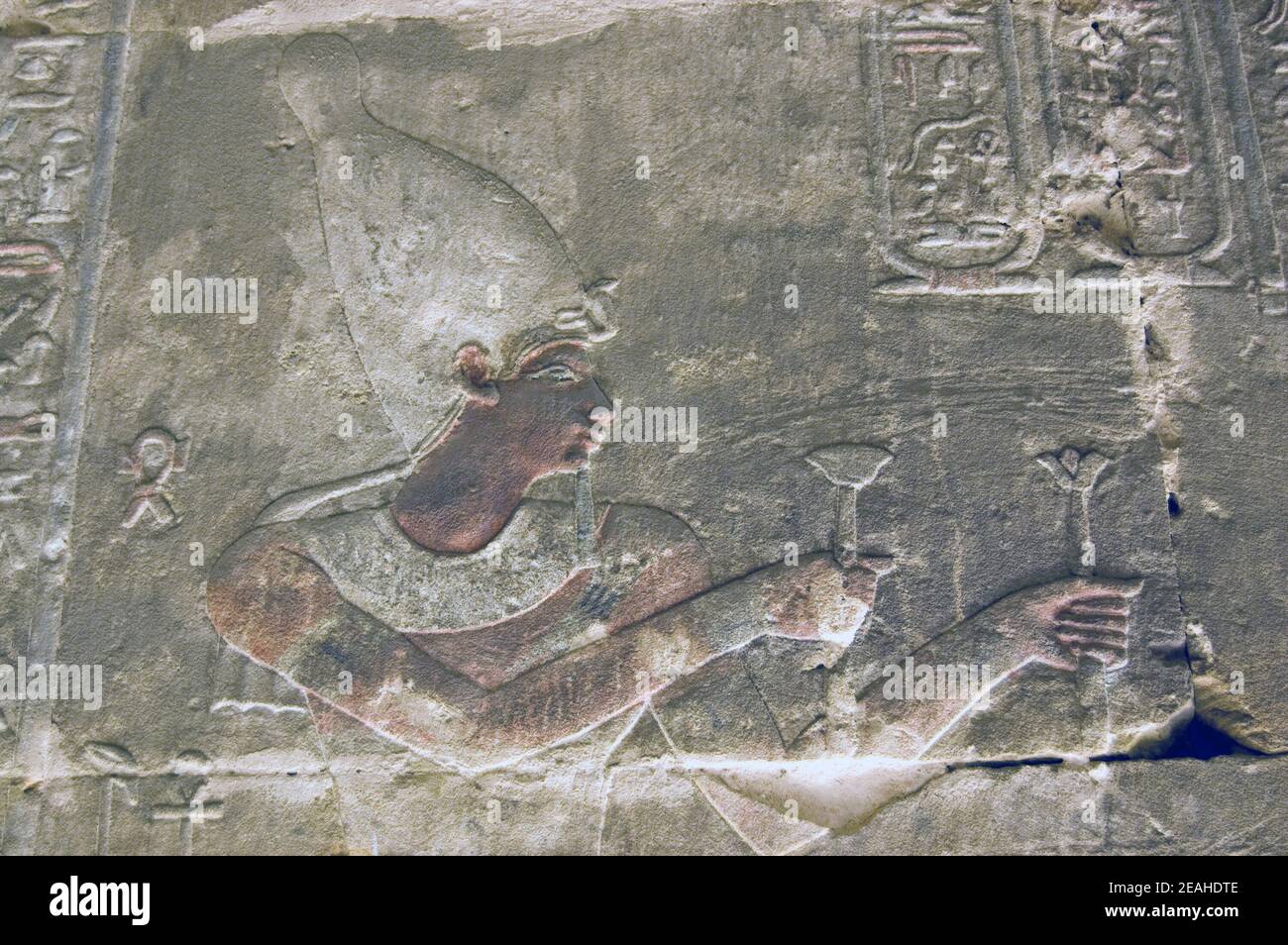 Ancient Egyptian carving of the Pharaoh making an offering of a lotus ...