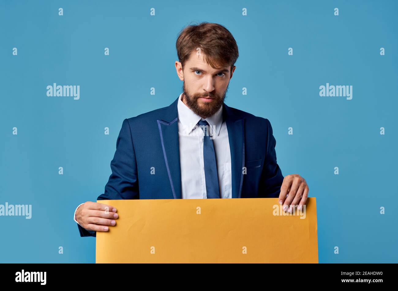 man in suit yellow mocap poster advertising official Stock Photo - Alamy