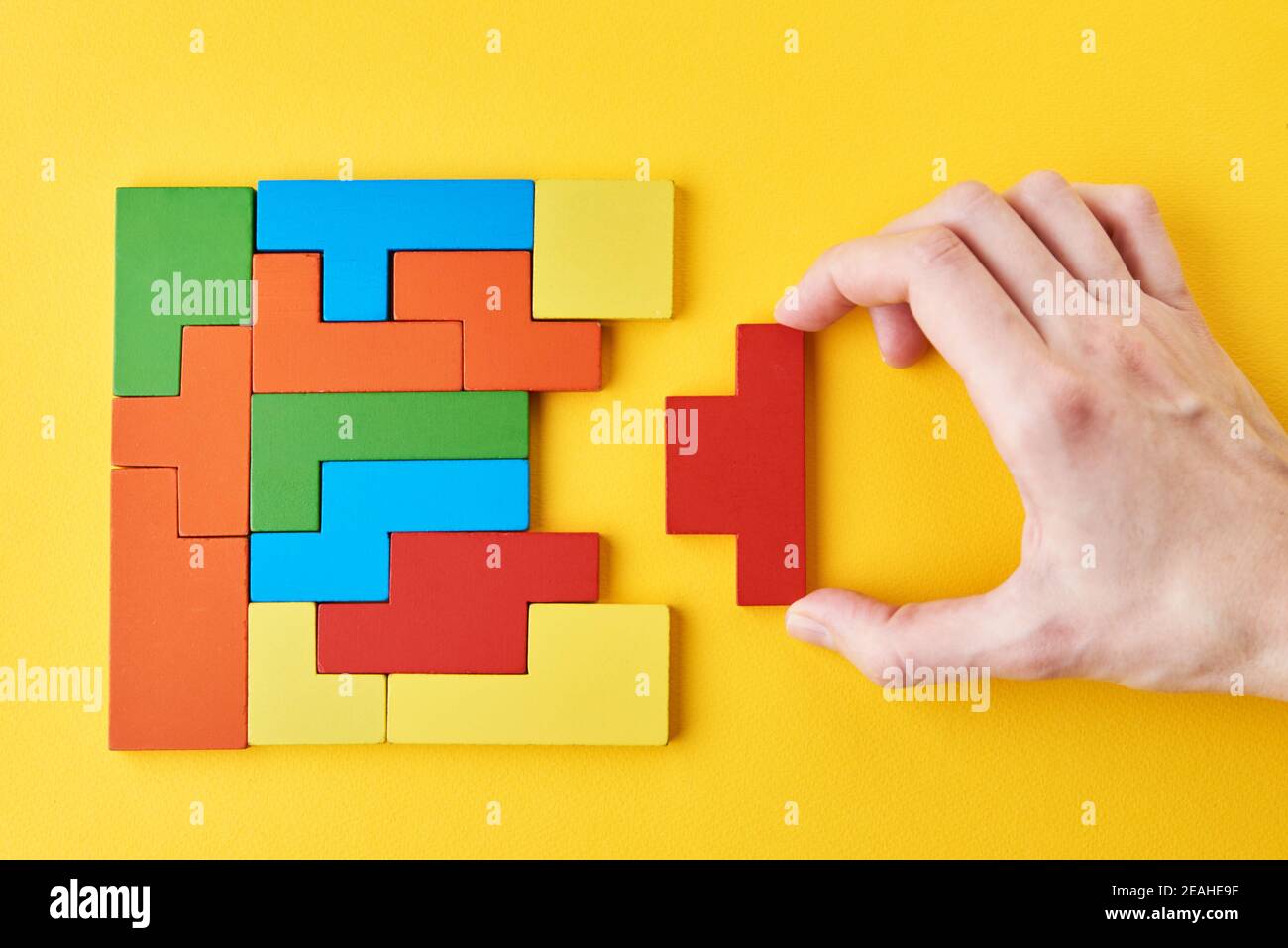 Logical thinking and finishing task concept. Woman hand adding last ...
