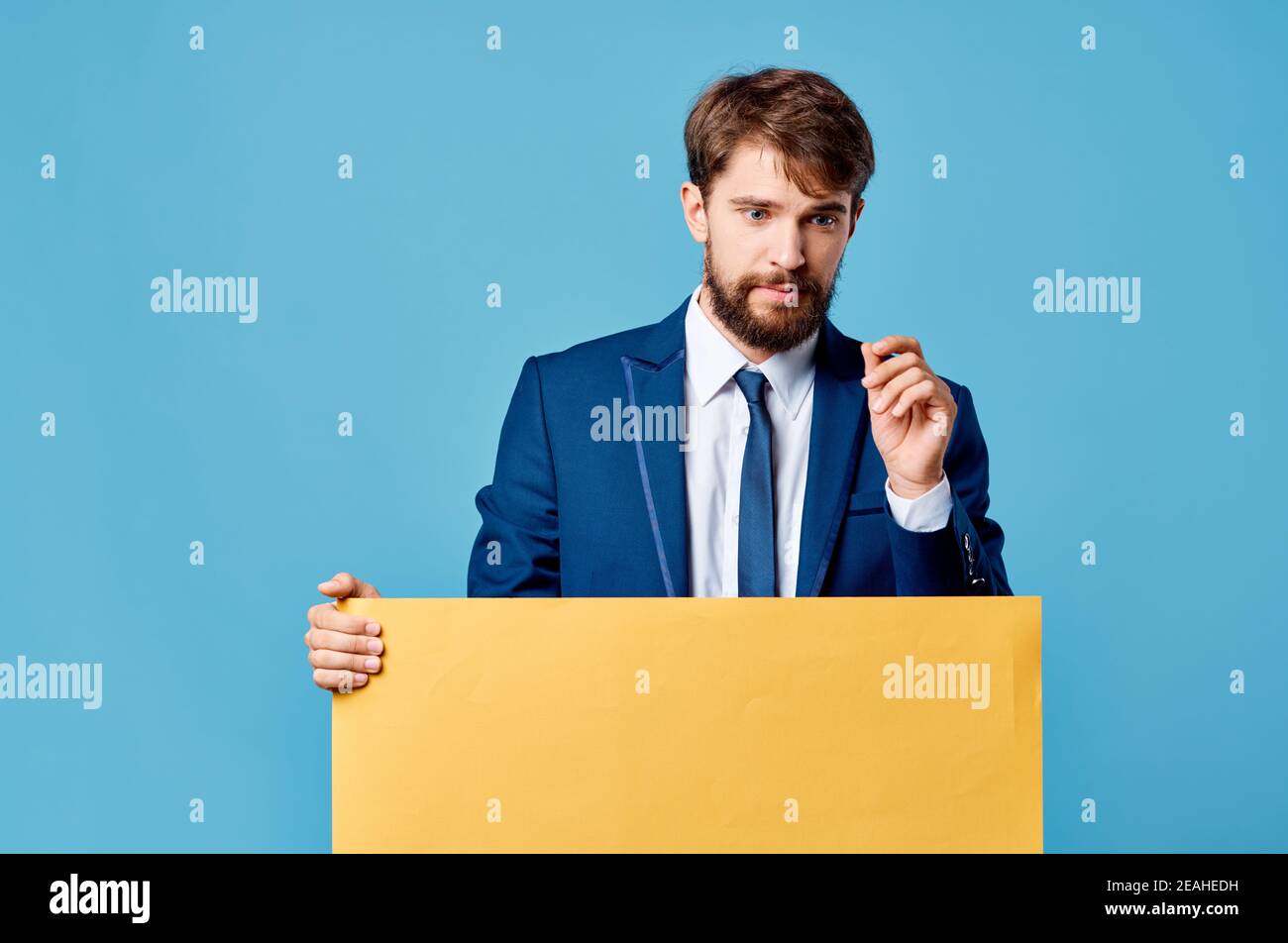 man in suit yellow mocap poster advertising official Stock Photo - Alamy