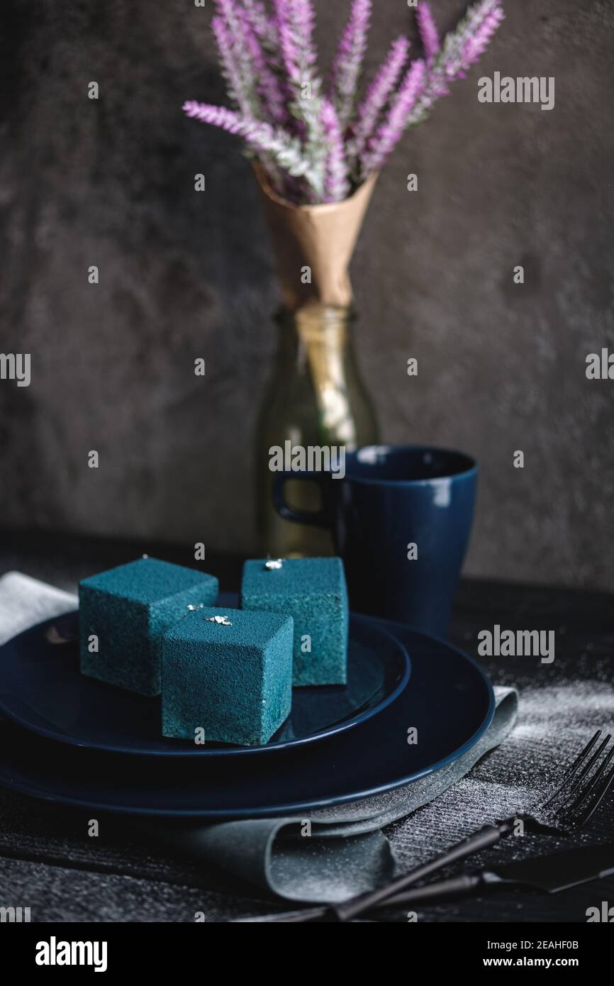 Blue cake filled with orange and tangerine in the shape of a cube ...