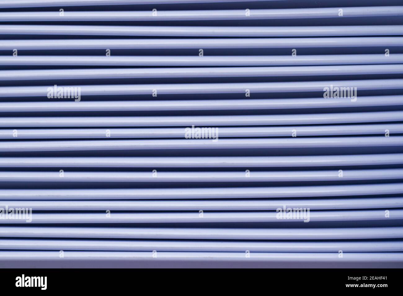 Closeup of light blue horizontal lines with a dark blue background ...