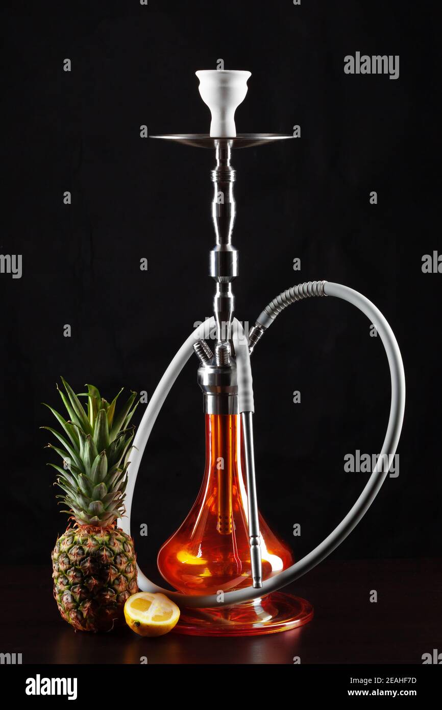 Fruit flavor hookah isolated on black background Stock Photo - Alamy