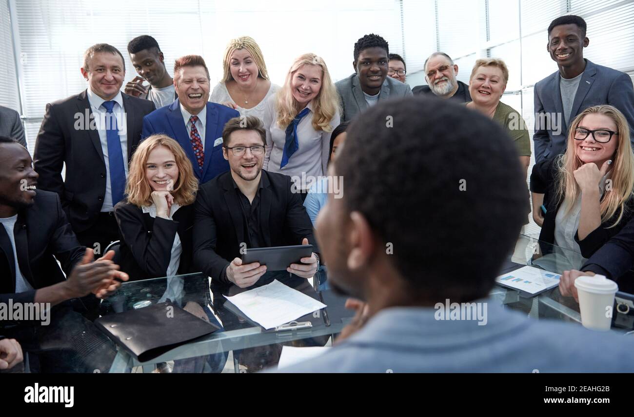 Executives sitting around meeting table hi-res stock photography and ...