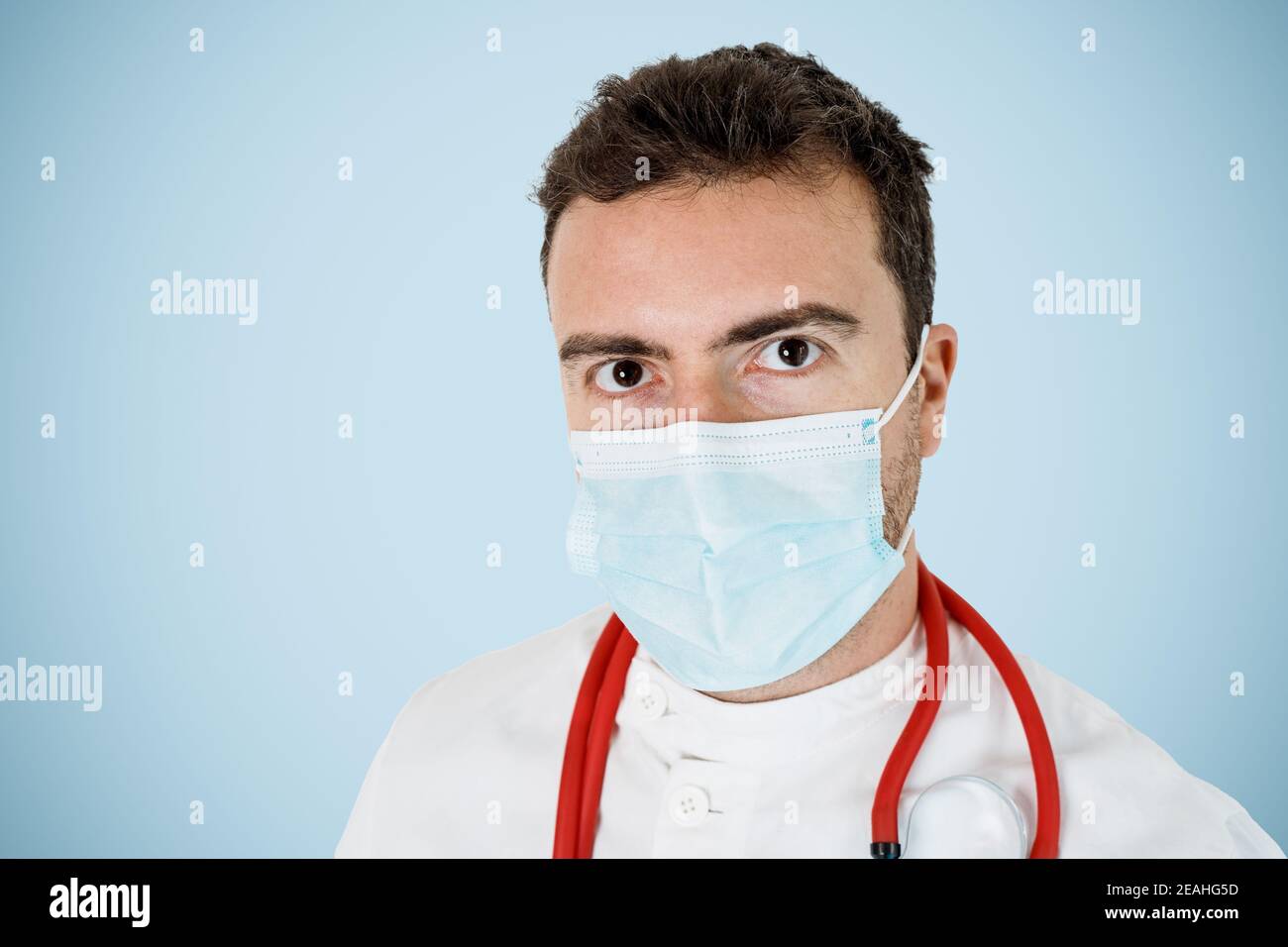 Portrait of male doctor with face mask on background Stock Photo - Alamy
