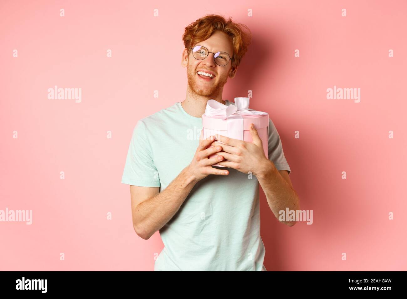 Valentines day and romance concept. Happy redhead boyfriend receive ...
