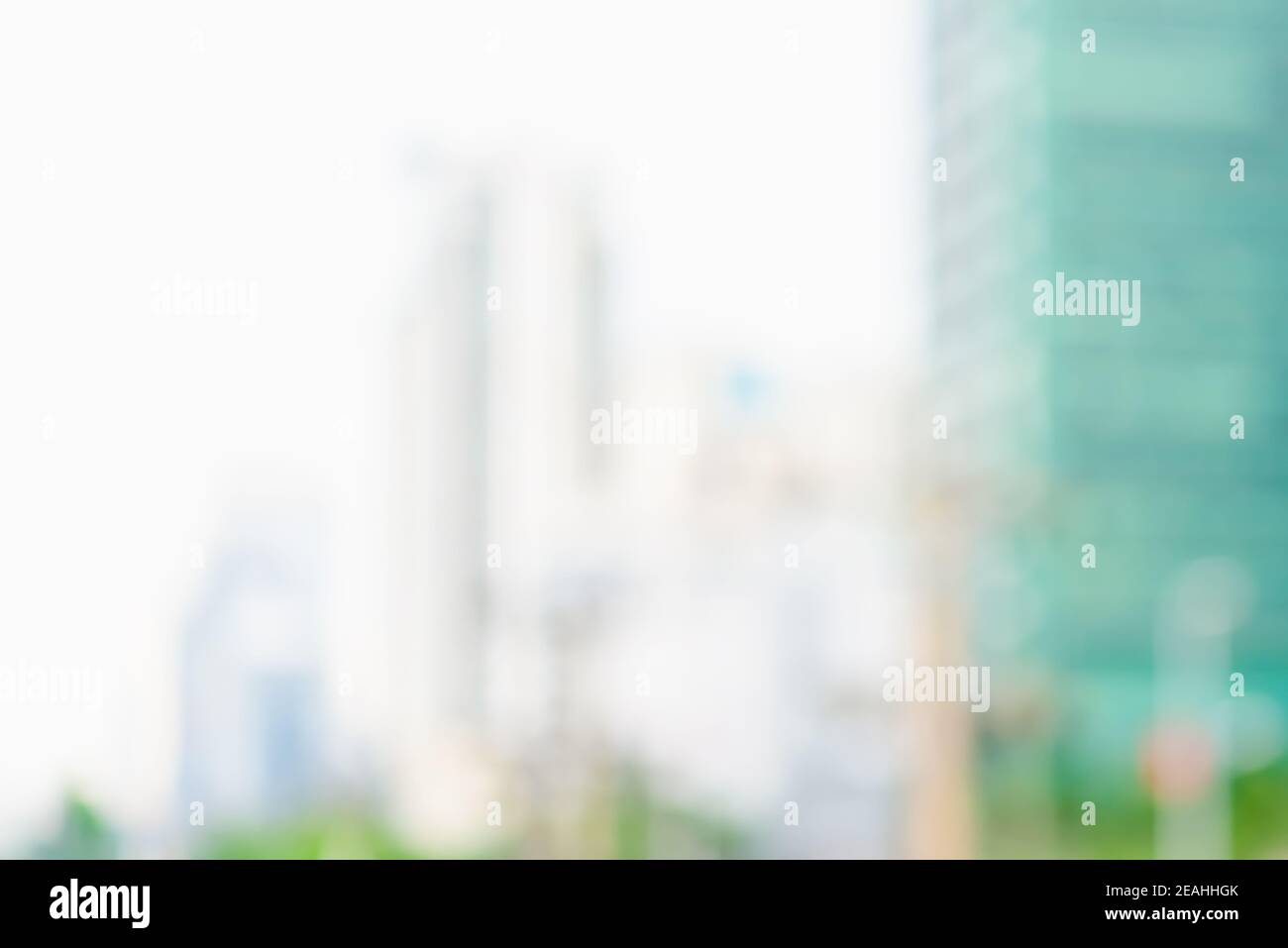 Blur white and green turquoise buildings in the city for background ...