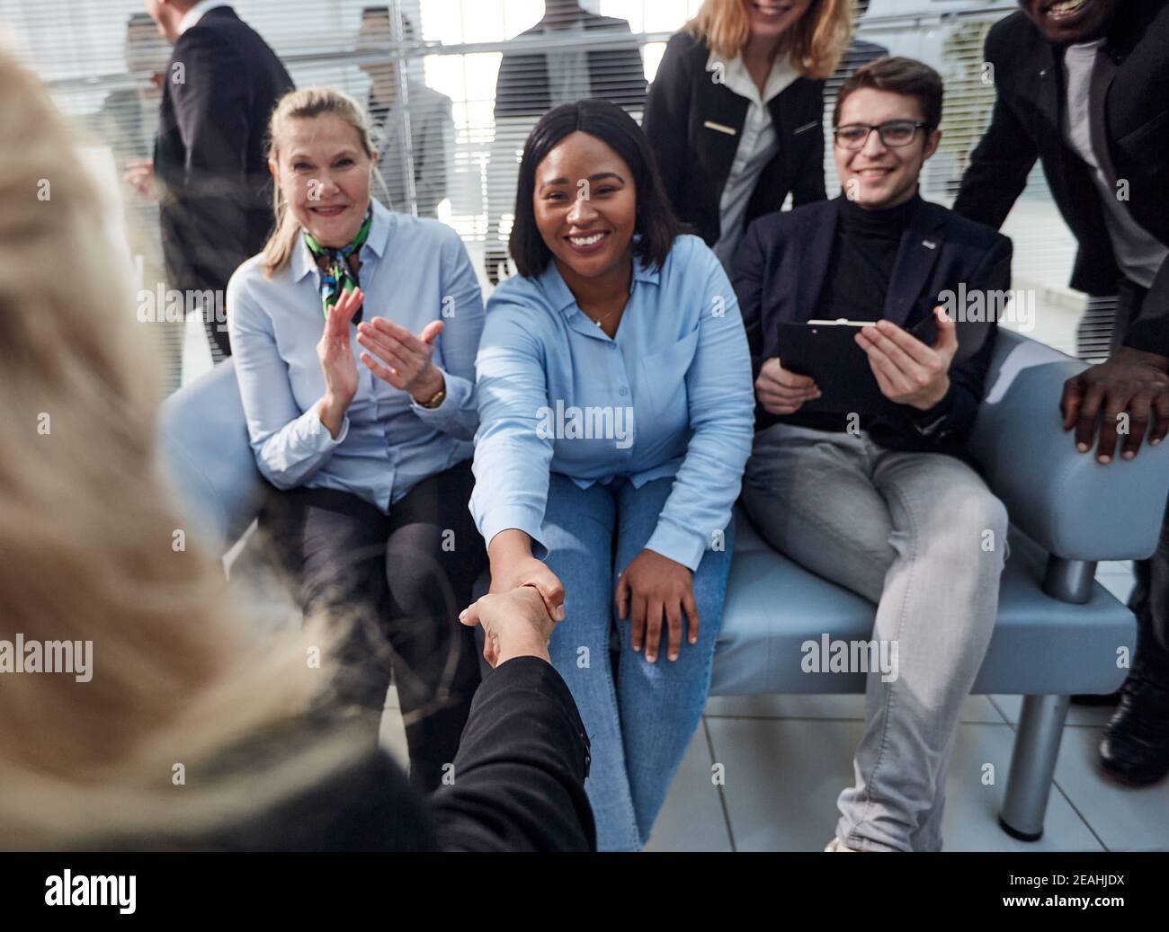 Great job. Successful business team is clapping their hands in modern ...