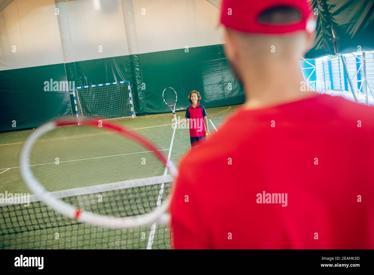 Close up picture of a back view of a man playing tennis Stock Photo - Alamy