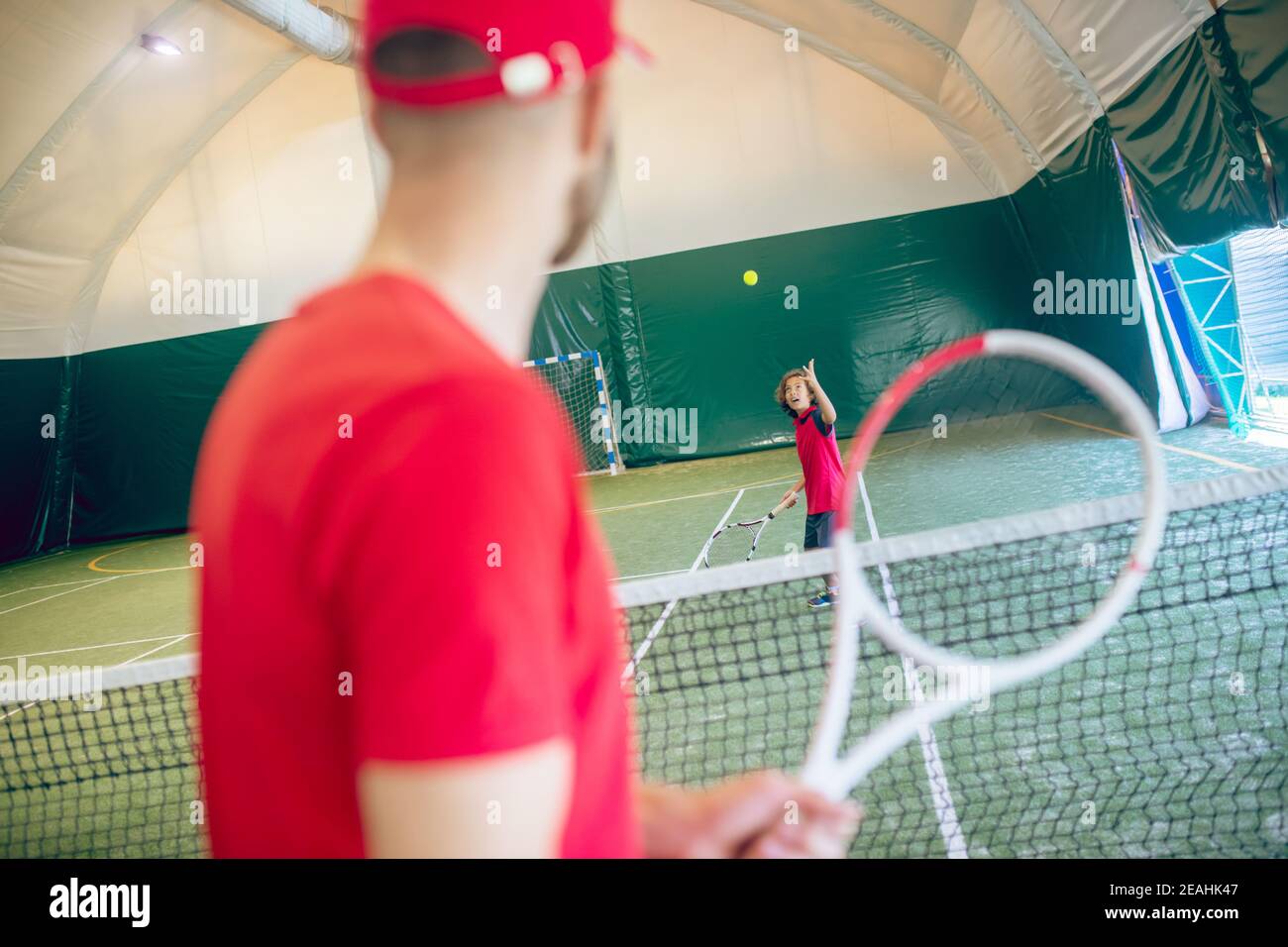 Close up picture of a back view of a man playing tennis Stock Photo - Alamy