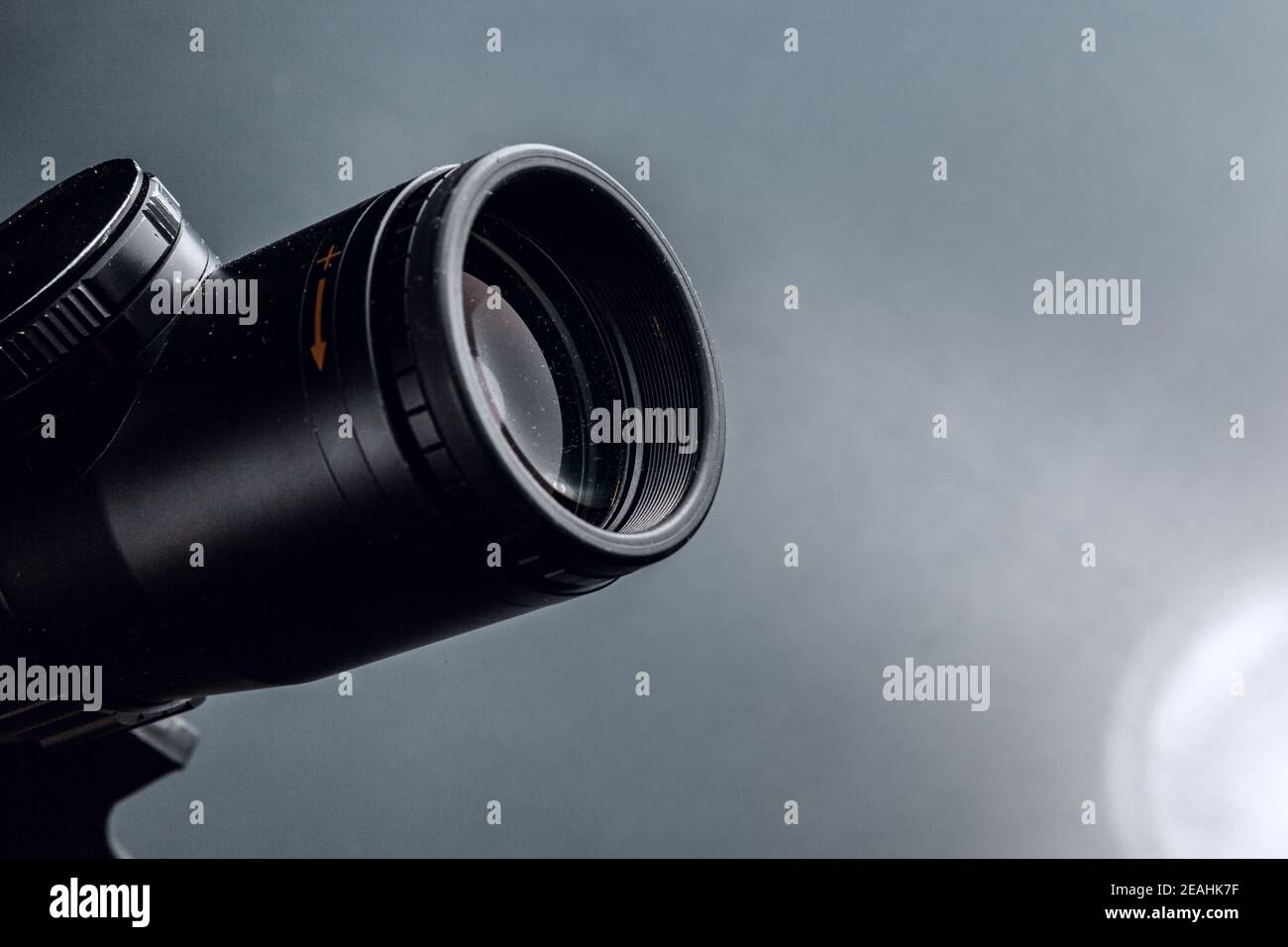 Black rifle optical sight on black background Stock Photo - Alamy
