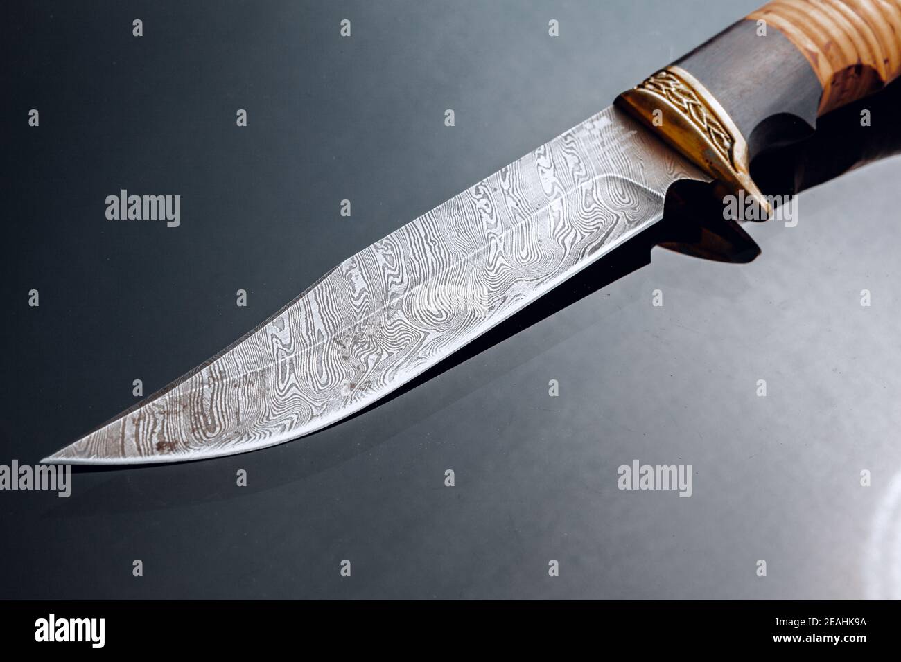 Hunting knife on black background with reflection Stock Photo - Alamy