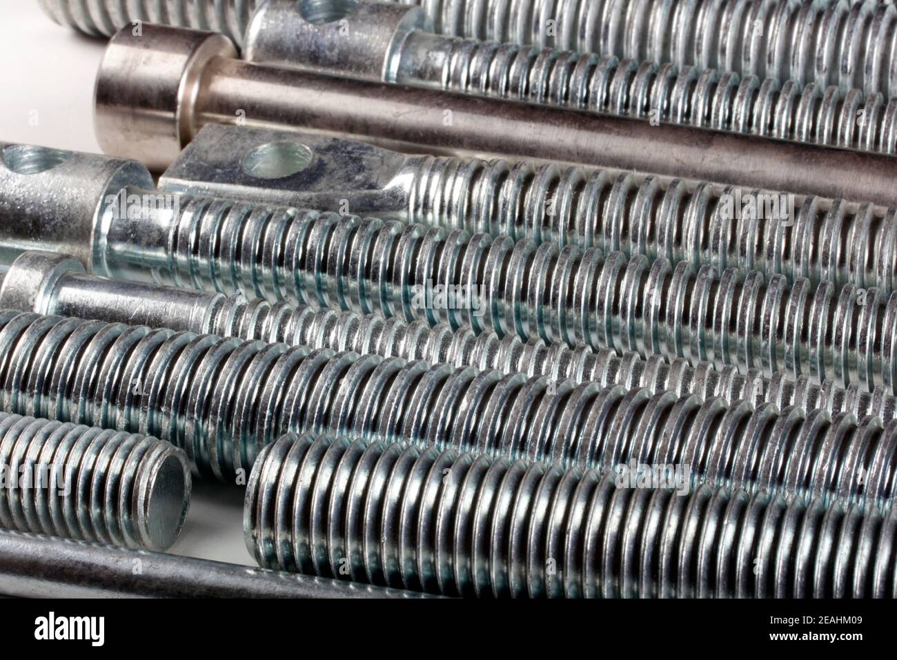 Newly manufactured large screws. Close up Stock Photo - Alamy