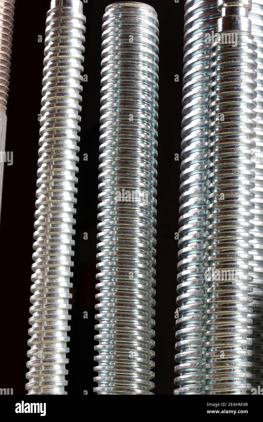 Newly manufactured large screws. Close up Stock Photo - Alamy