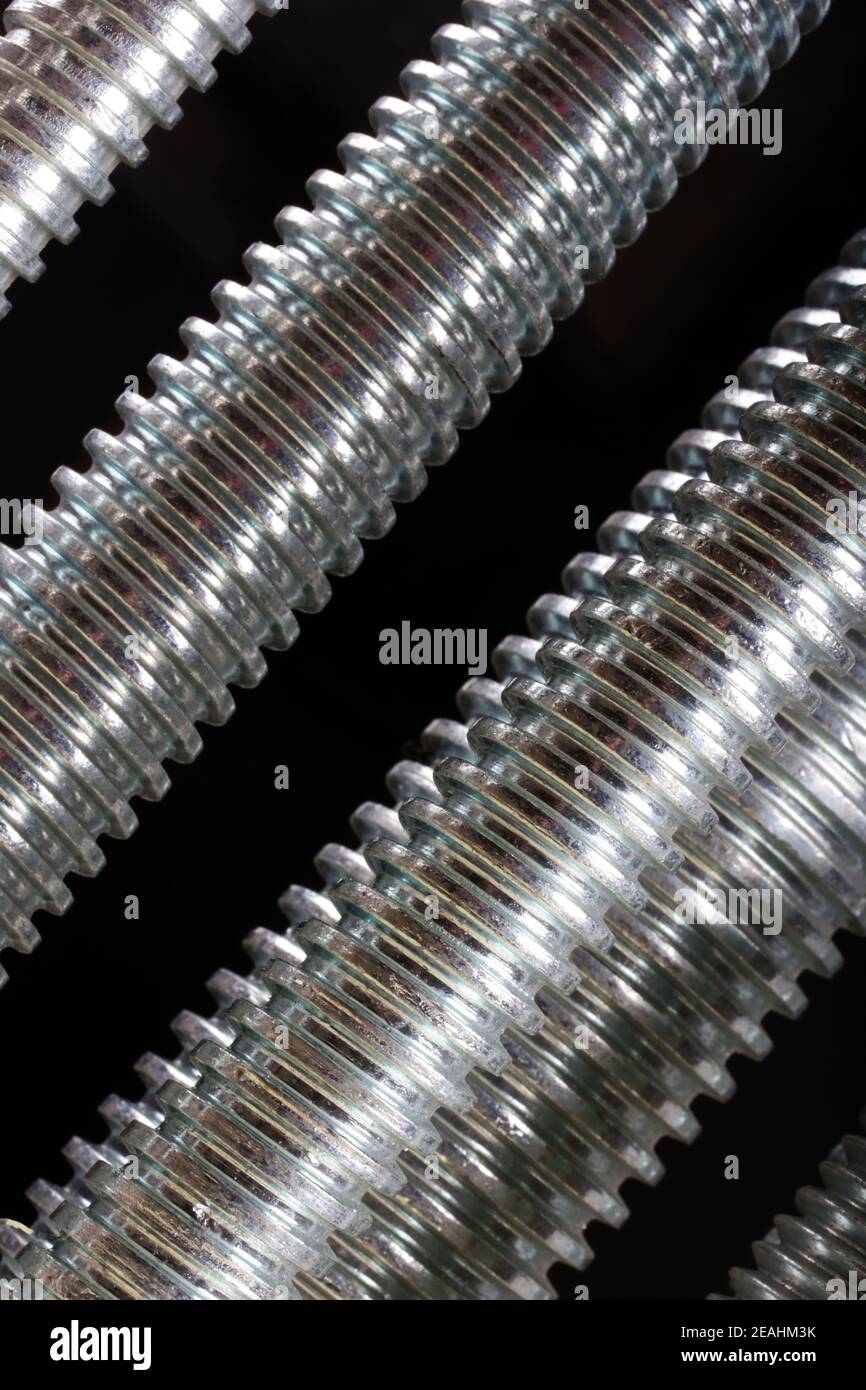 Newly manufactured large screws. Close up Stock Photo - Alamy
