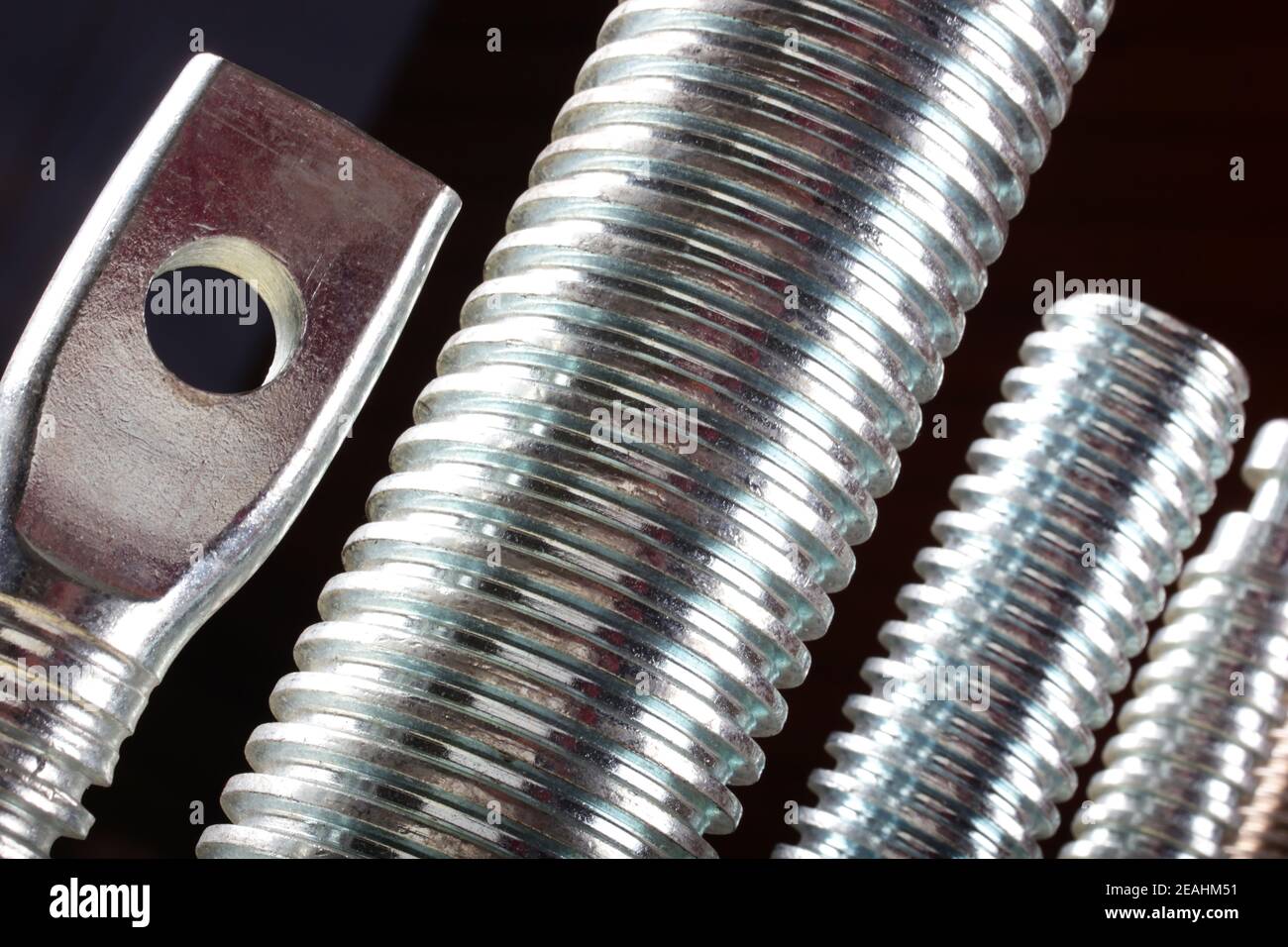 Newly manufactured large screws. Close up Stock Photo - Alamy