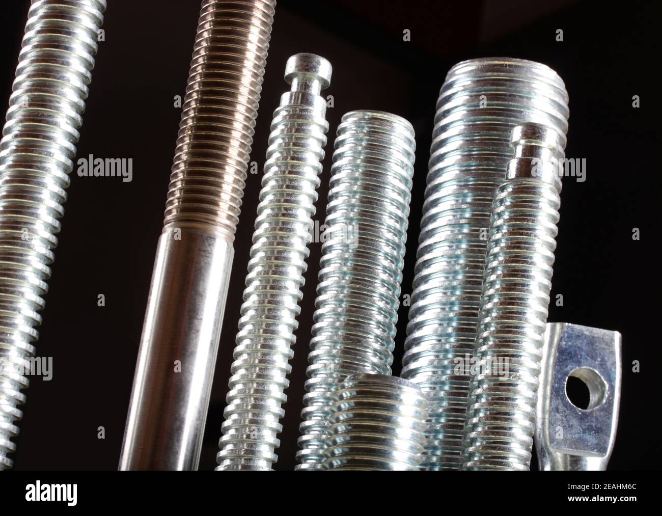 Newly manufactured large screws. Close up Stock Photo - Alamy