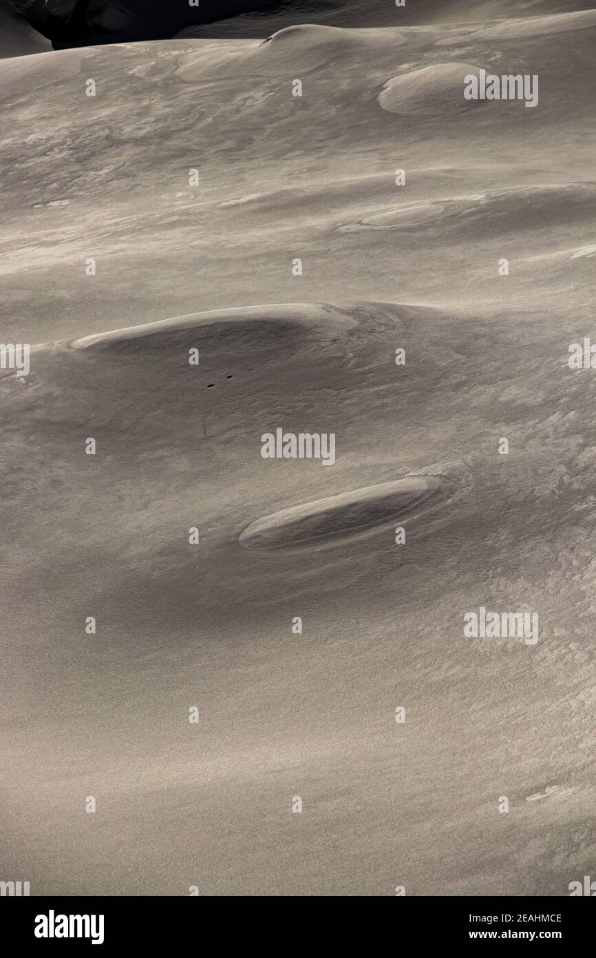 Patterns in snow made by nature, day time Stock Photo - Alamy