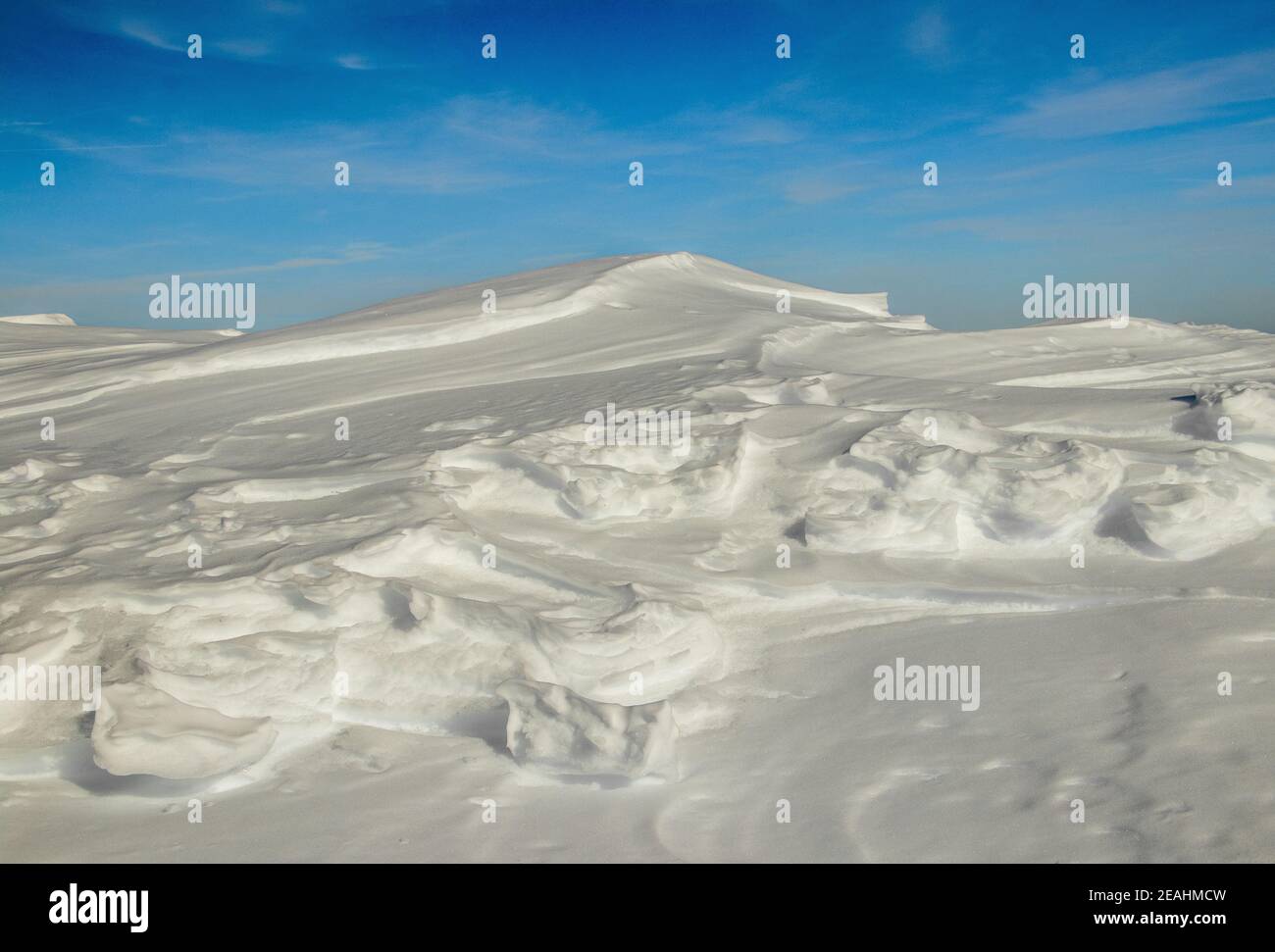 Snow patterns made by nature with sky Stock Photo - Alamy