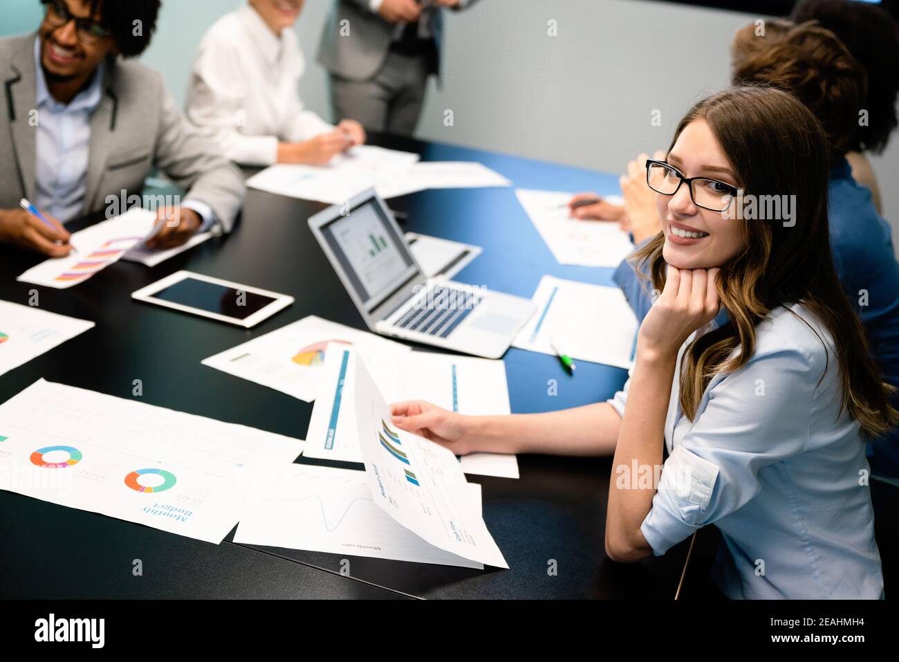Business colleagues in conference meeting room during presentation ...