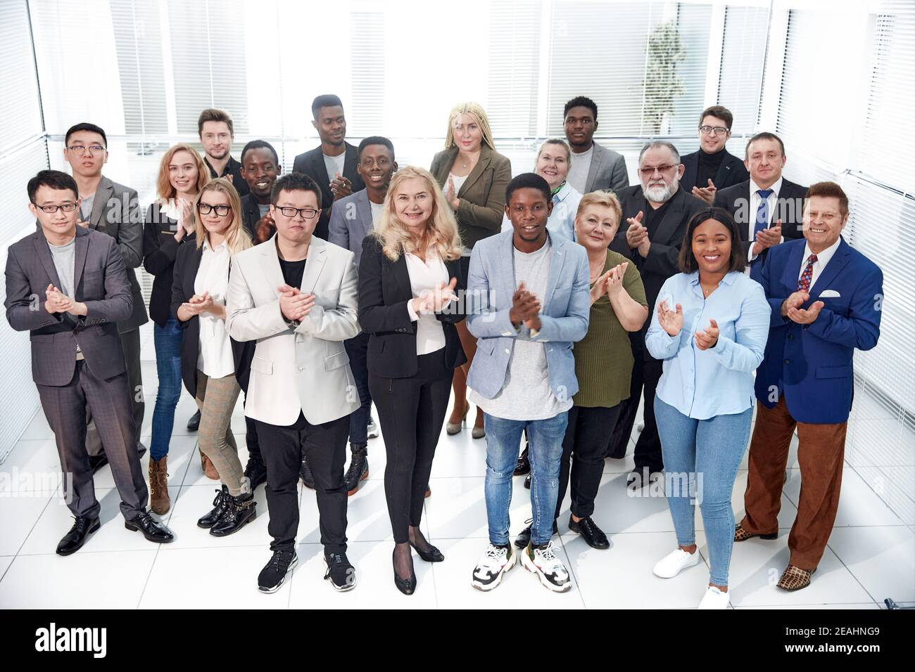 group of diverse corporate employees applauding together Stock Photo ...