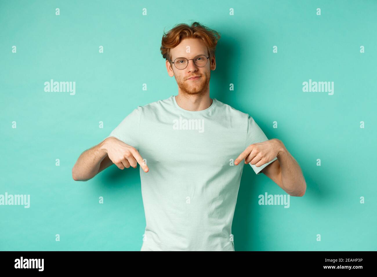 Skeptical and bothered man with ginger hair and beard, wearing glasses ...