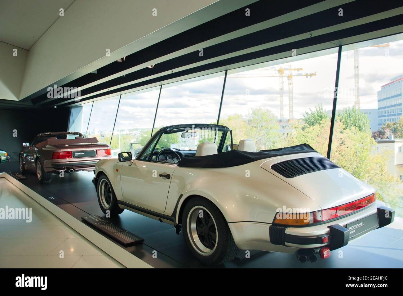 White car next to a window overlooking Stuttgart, Germany at the ...