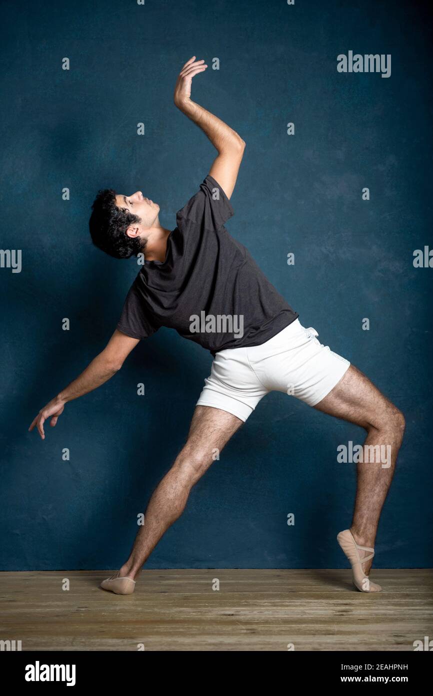Italian male ballet dancer in edgy dance poses in the photo studio ...