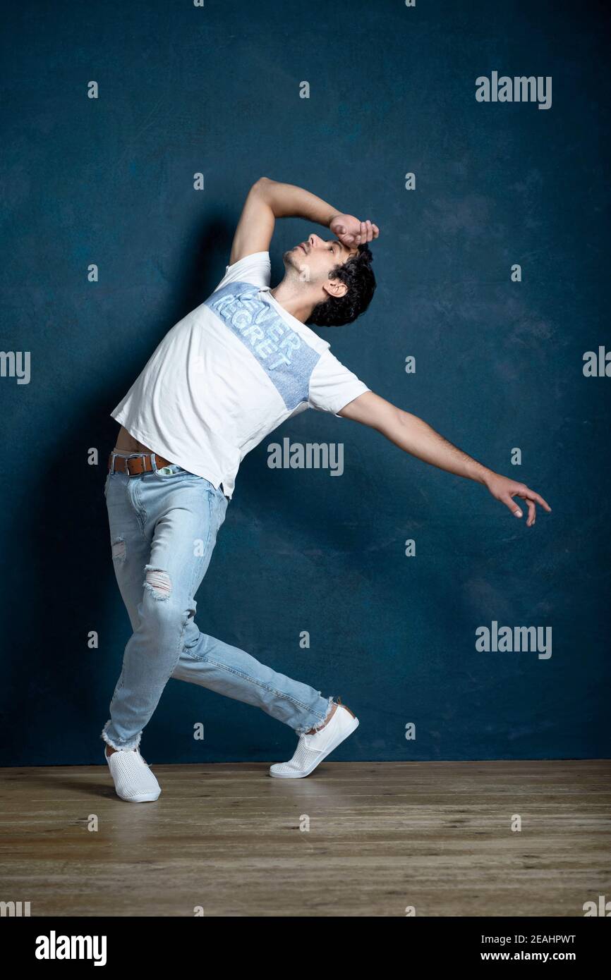 Italian male ballet dancer in edgy dance poses in the photo studio ...