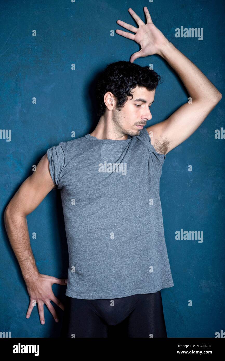 Male dancer in dynamic, modern dance poses and body movement in the ...