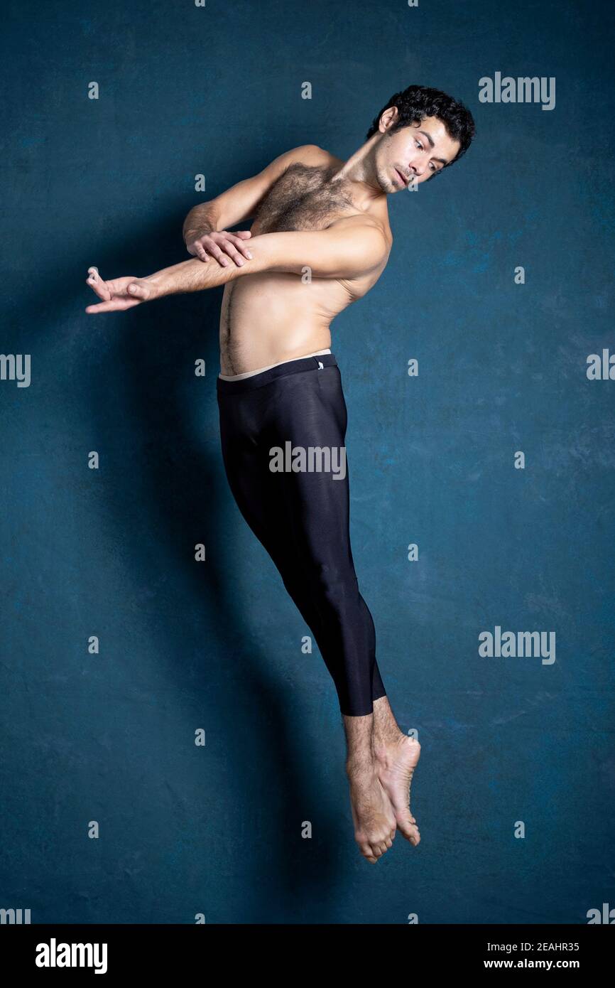 Male dancer in dynamic, modern dance poses and body movement in the ...