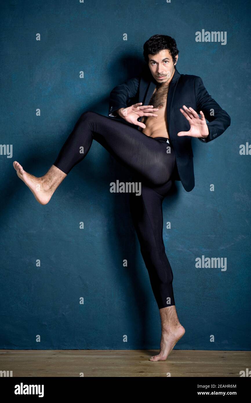 Male dancer in dynamic, modern dance poses and body movement in the ...