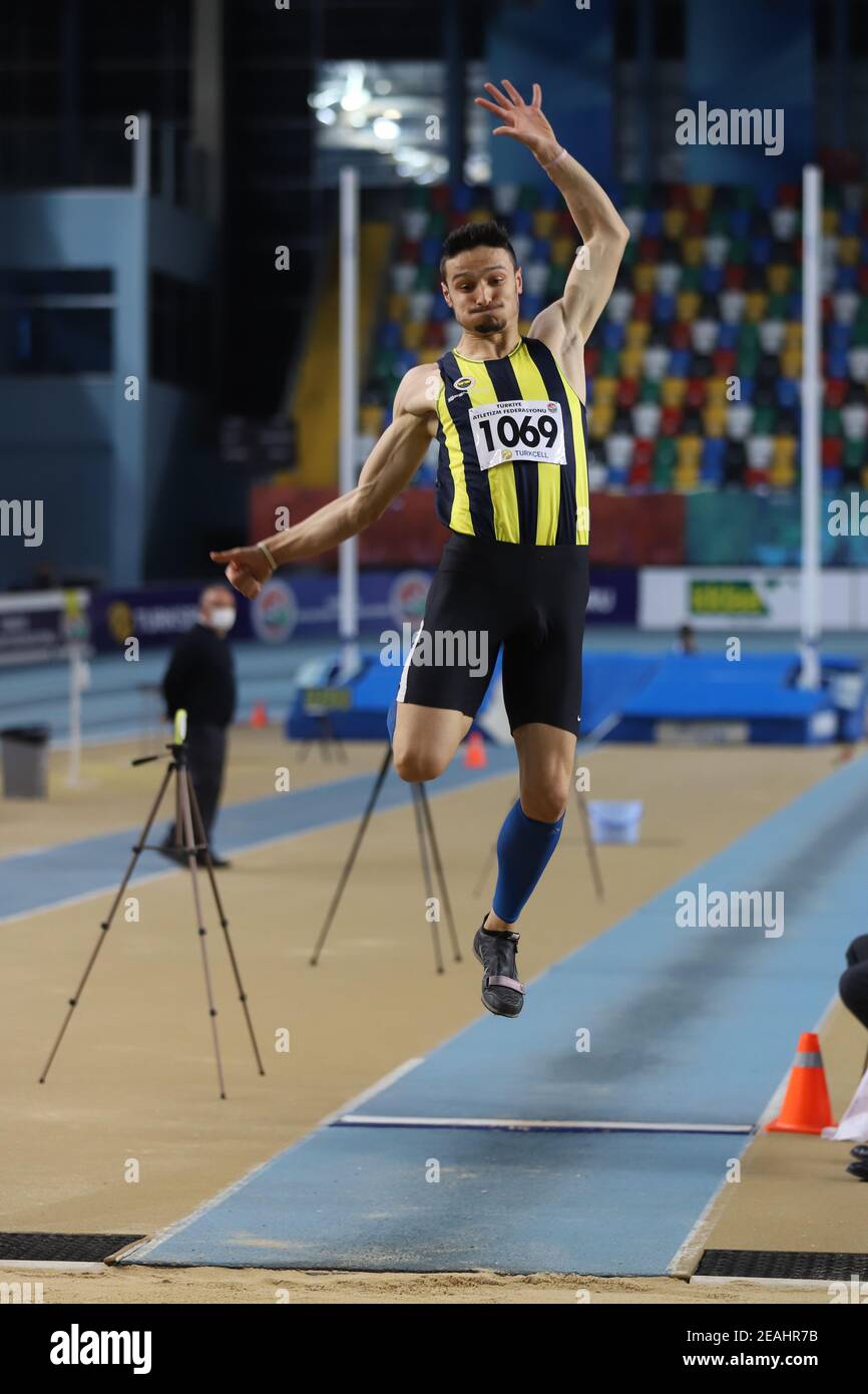 ISTANBUL, TURKEY - FEBRUARY 06, 2021: Undefined athlete long jumping ...