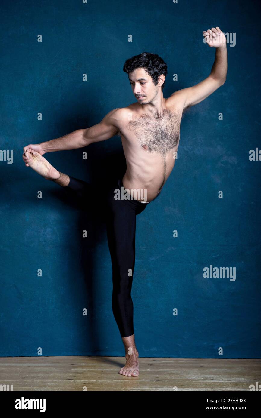 Male dancer in dynamic, modern dance poses and body movement in the ...