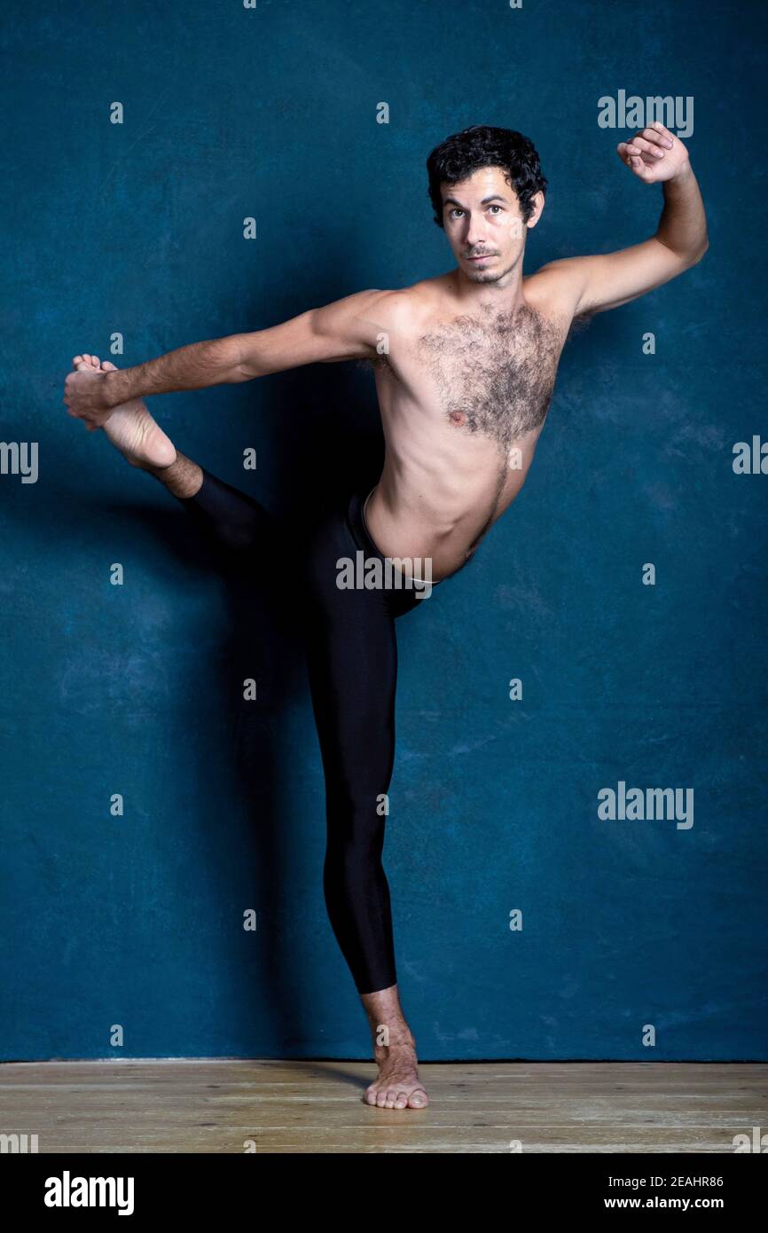 Male dancer in dynamic, modern dance poses and body movement in the ...