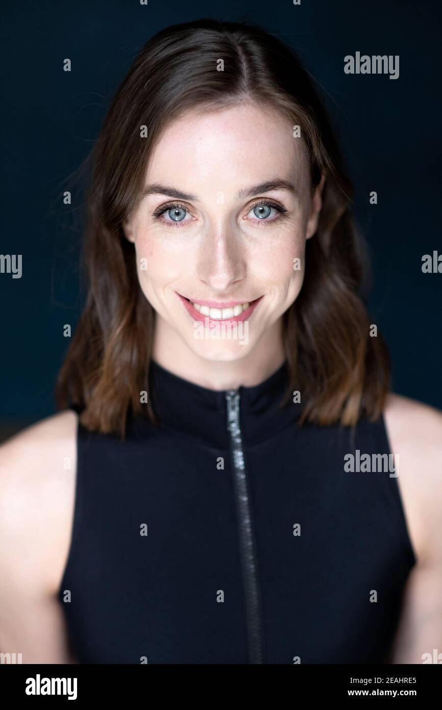 Head And Shoulders Portrait Of Young Woman With Shoulder Length Brown