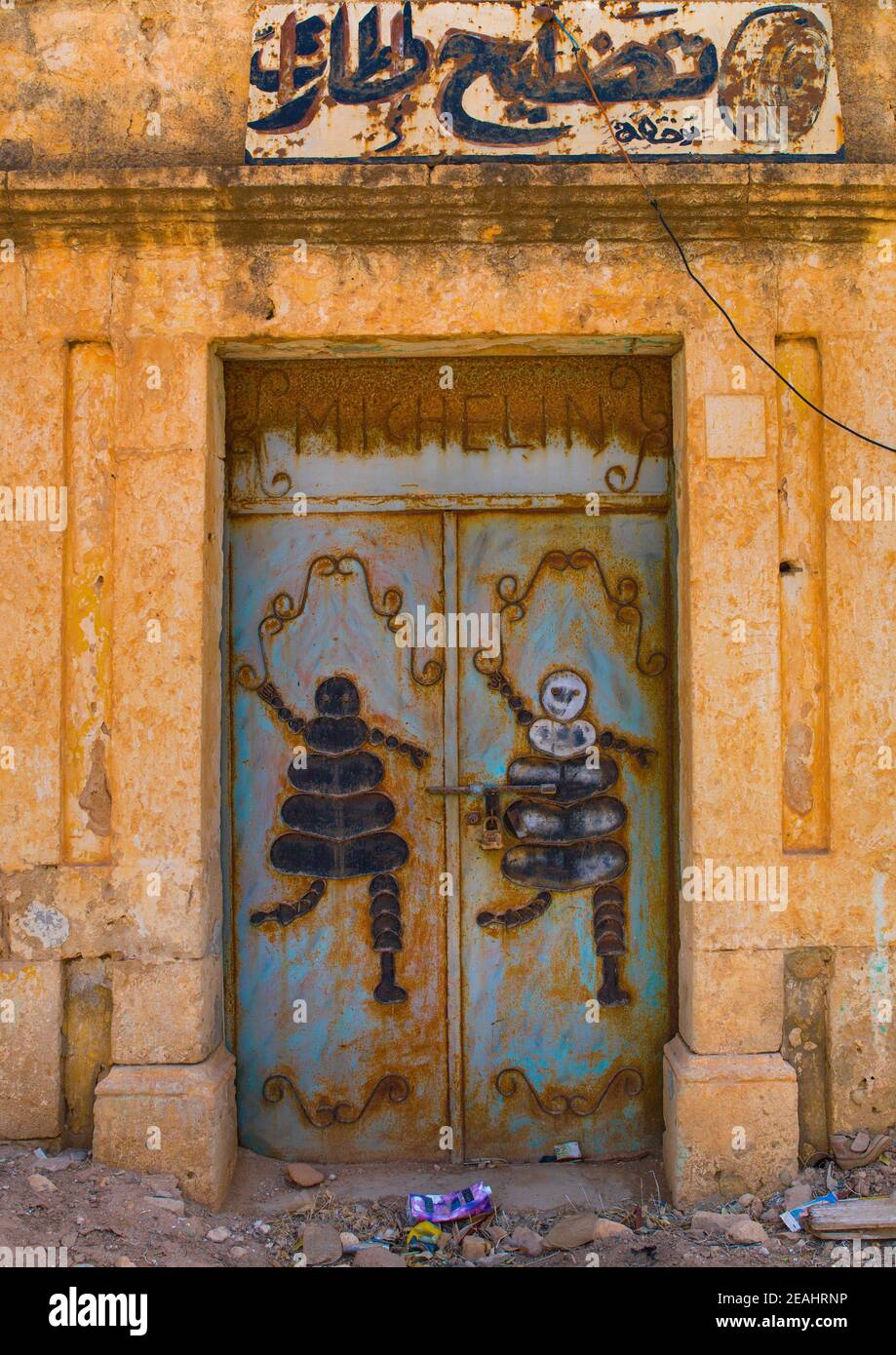 Old italian colonial shop with michelin bibendum, Cyrenaica, Ptolemais ...