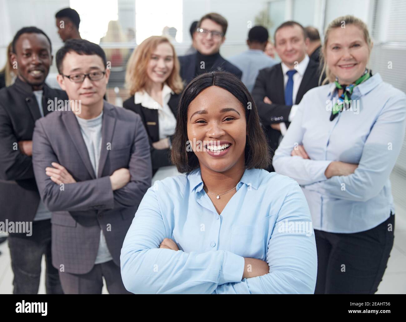 group of leading experts standing in the office lobby Stock Photo - Alamy