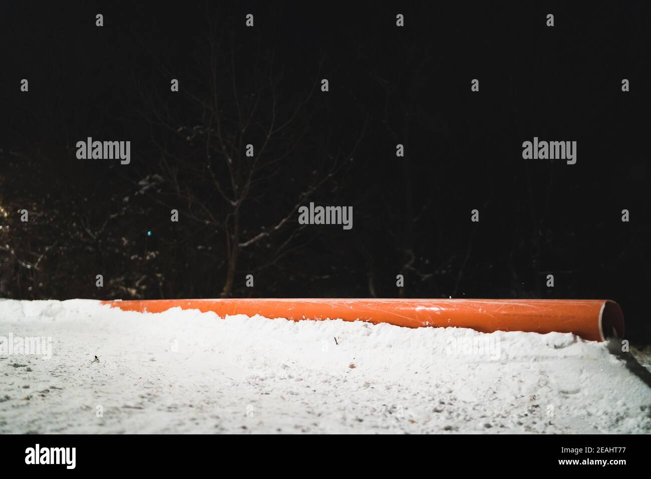 Bright orange ski rail at snow park. Night shot Stock Photo - Alamy