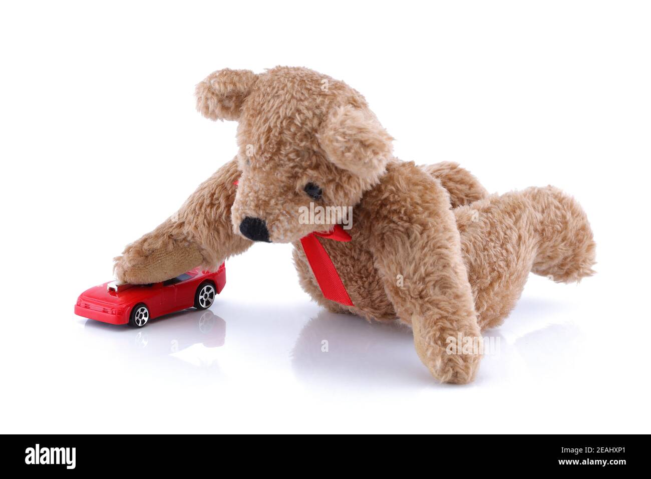 Teddy bear playing with his toy car Stock Photo - Alamy