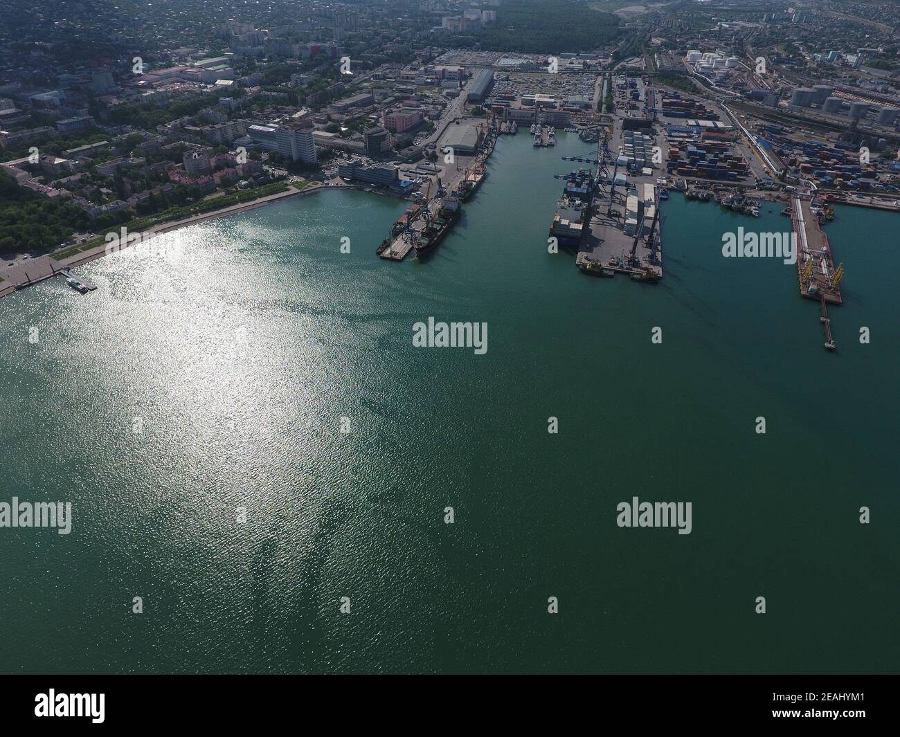 Industrial seaport, top view. Port cranes and cargo ships and barges ...